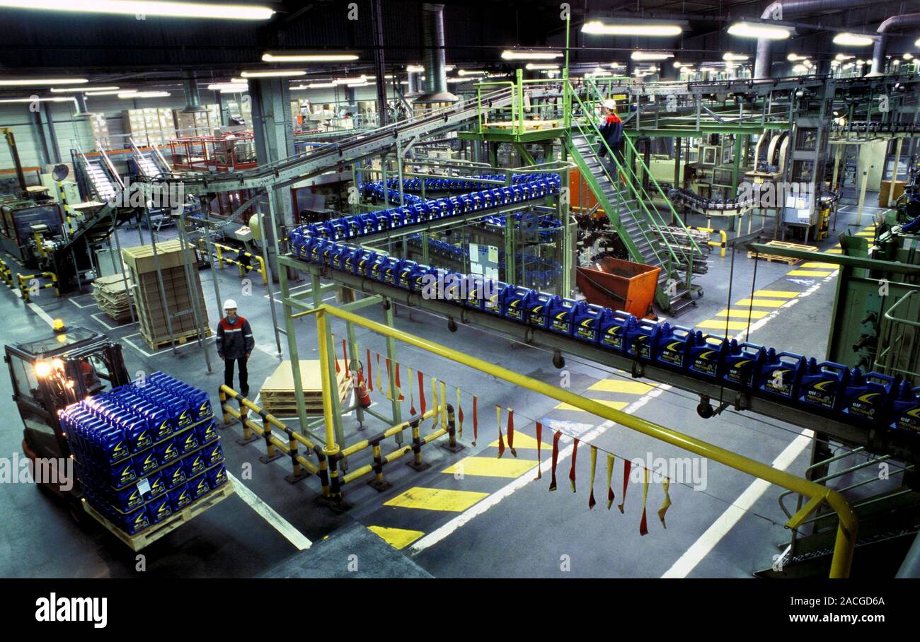 Factory production line. Factory workers on the production line of a ...