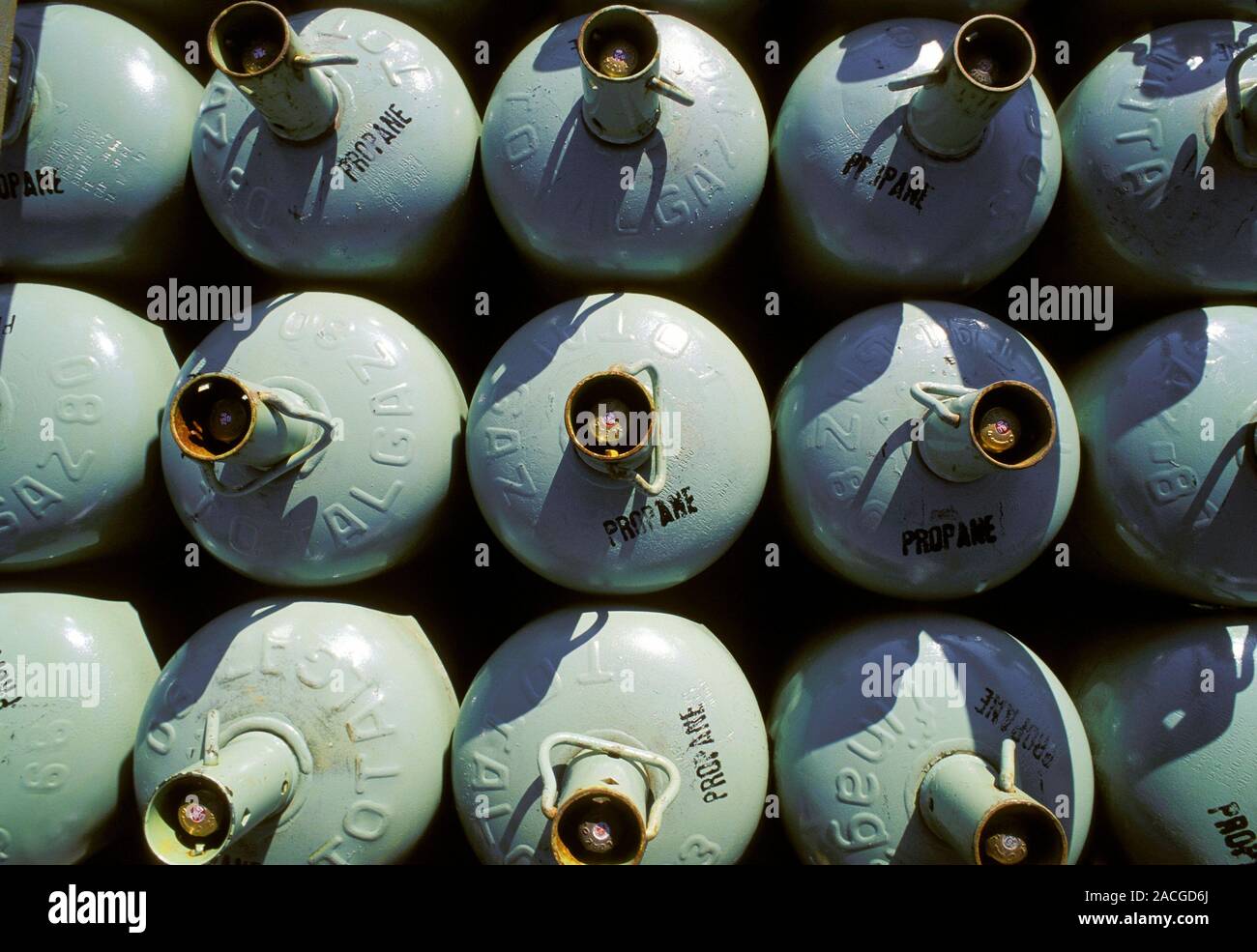 Gas cylinders stored on top on each other Stock Photo - Alamy