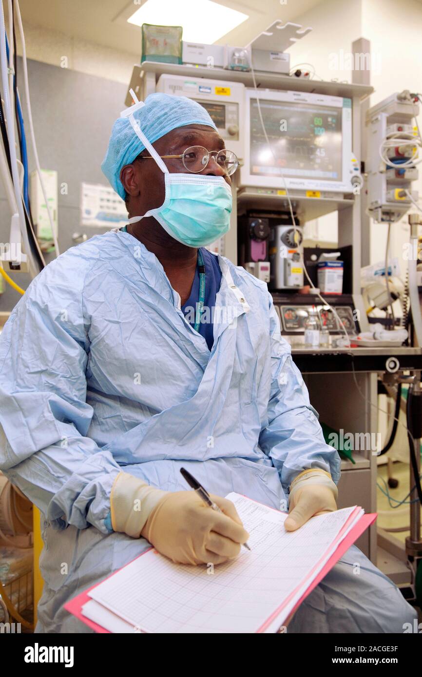 Doctor taking notes during surgery Stock Photo - Alamy