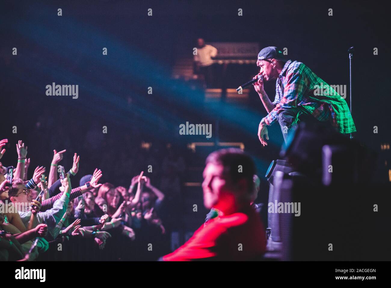 Man singing to crowd at concert Stock Photo - Alamy