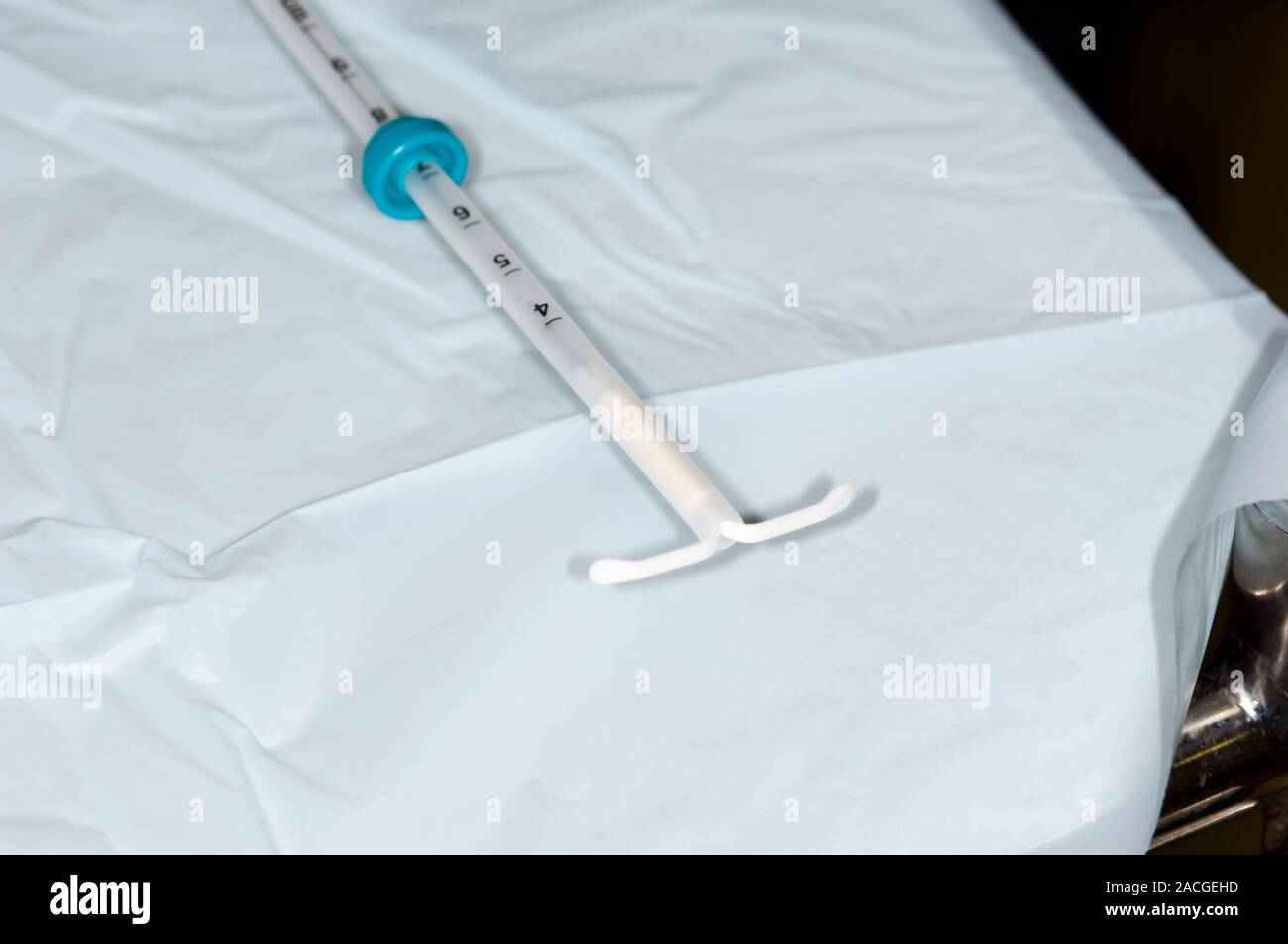 IUD contraceptive insertion tool. This intrauterine device (IUD), made ...