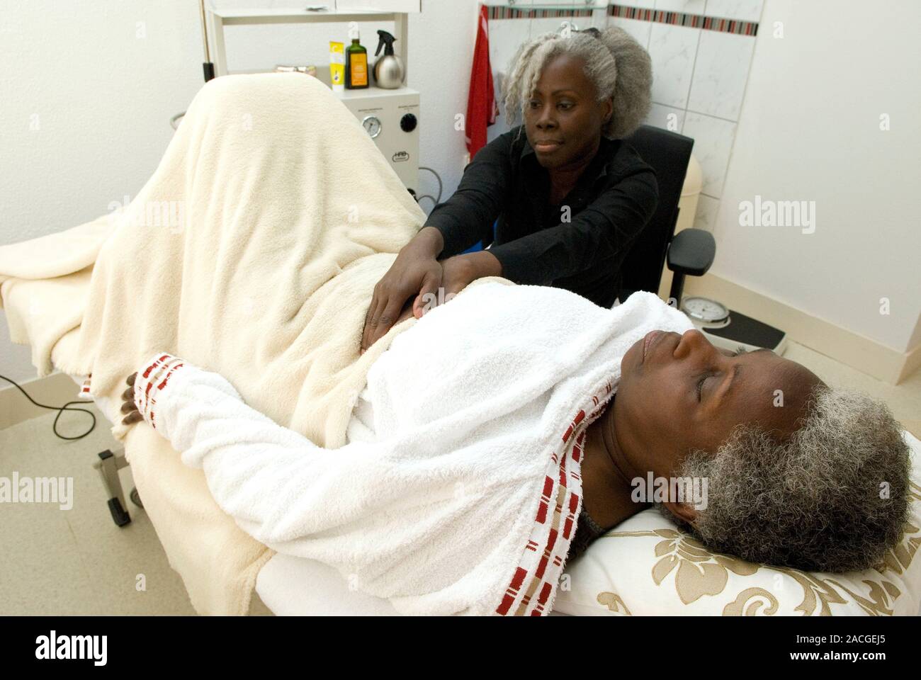 Colonic irrigation. Patient undergoing colonic irrigation, or colon ...