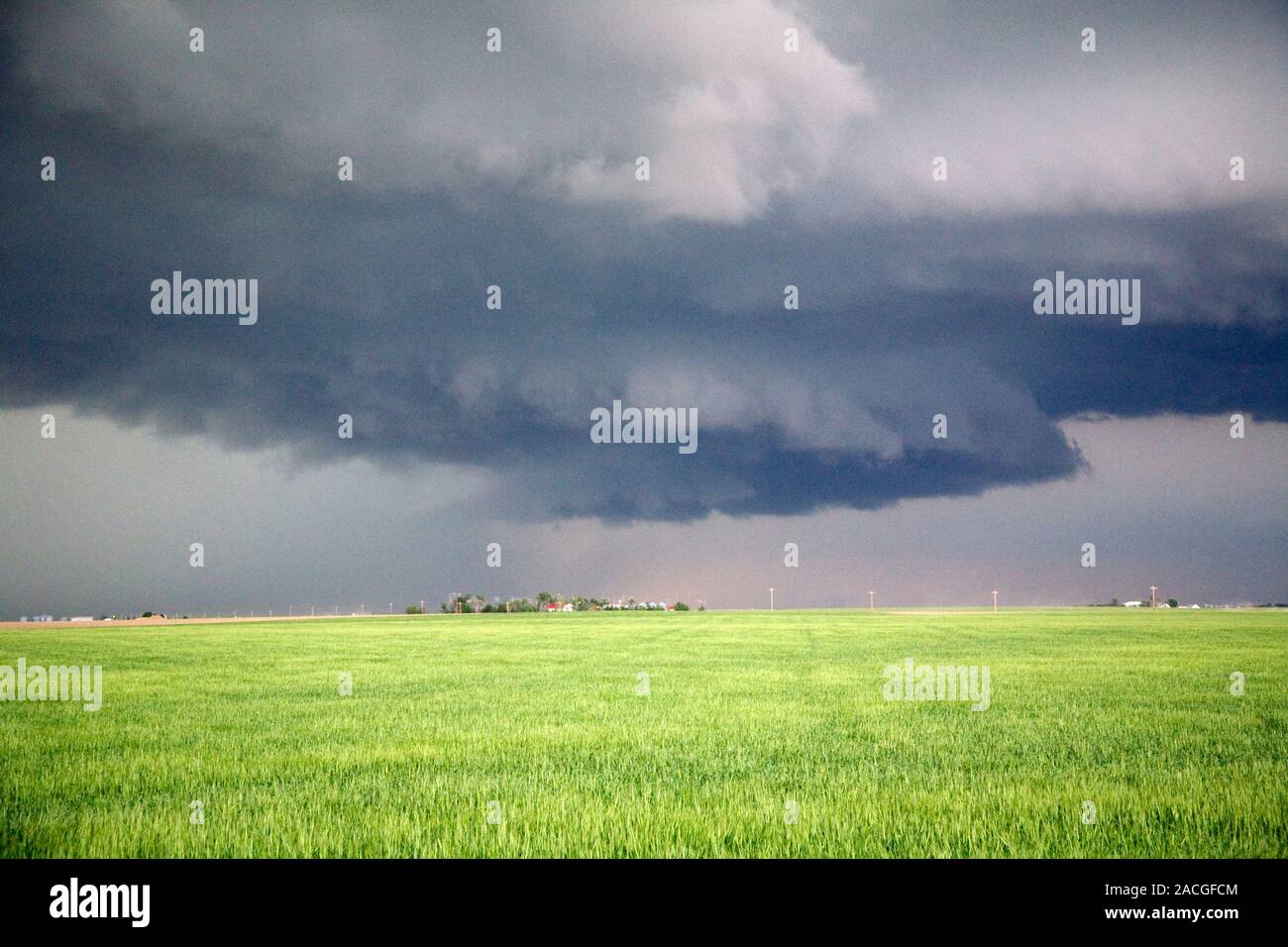 Rotating wall cloud. Wall cloud (centre) of a tornadic thunderstorm ...