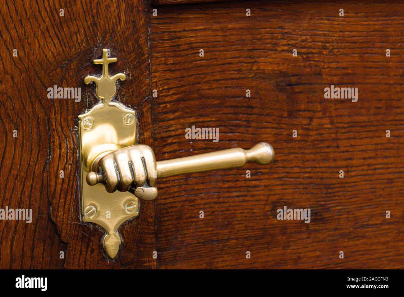Holy Cross, old, door, doorhandle with a hand and holy staff Stock ...