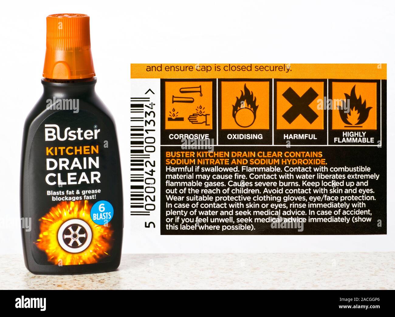 Drain cleaner with hazard warning notices. Drain cleaners are mixtures ...
