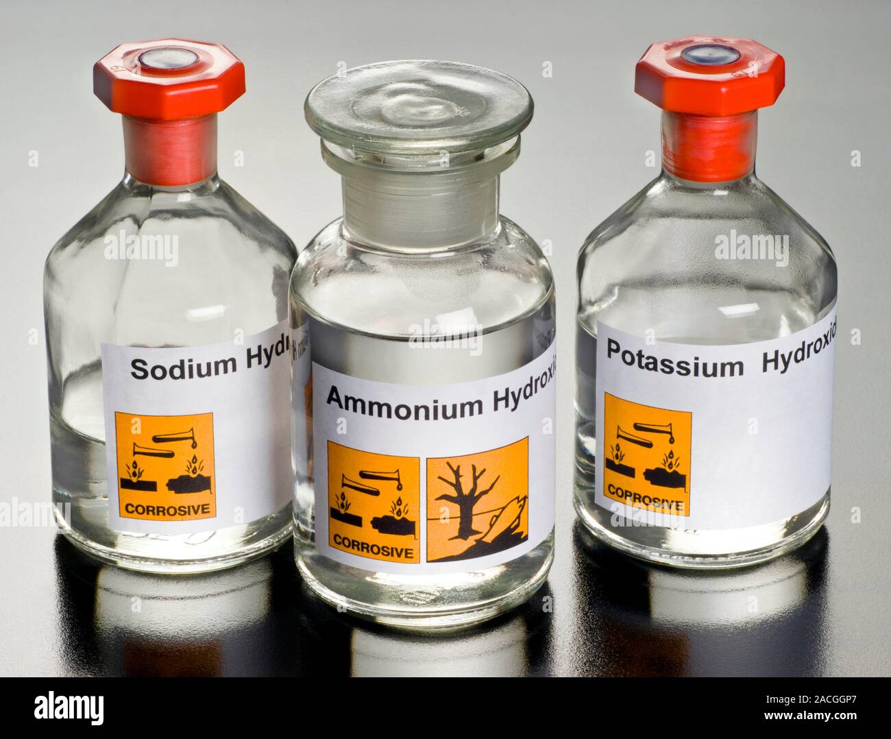 Strong alkalis in laboratory bottles. From left to right the alkalis ...