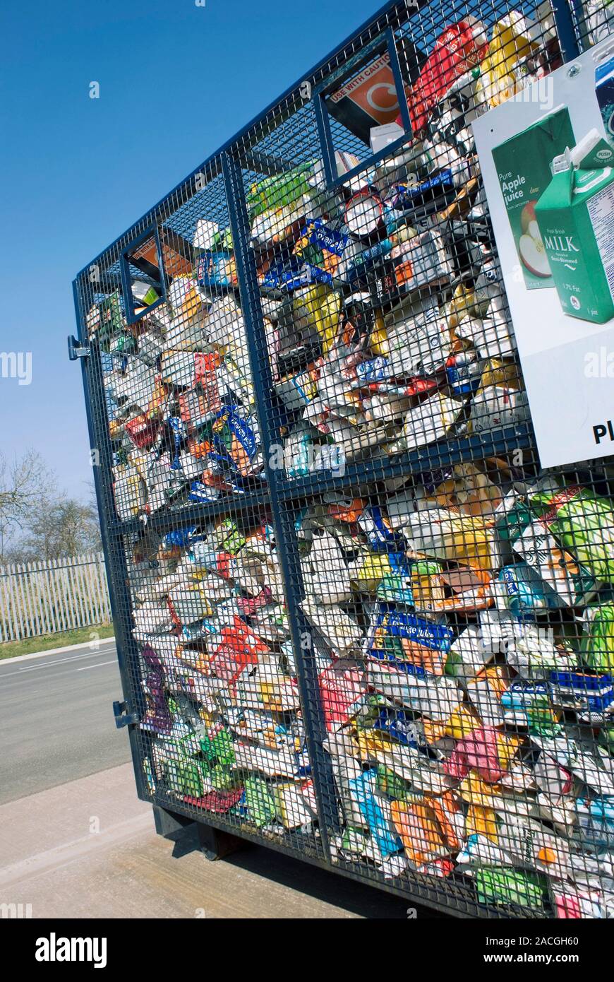 Recycling centre. Drinks cartons in a metal cage at the Flusco ...