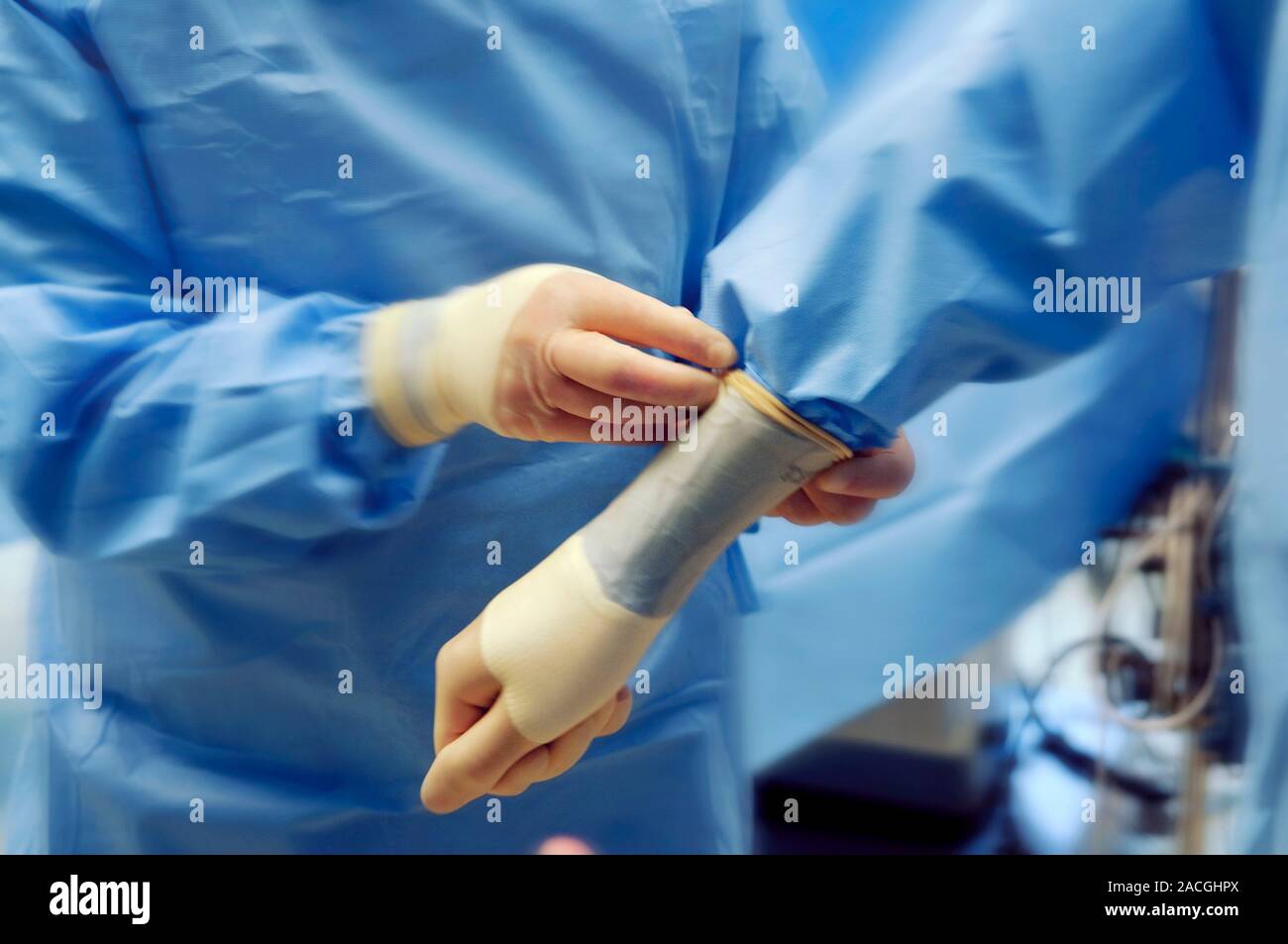 Slipped disc microendoscopy surgery. Surgeons preparing to perform an ...