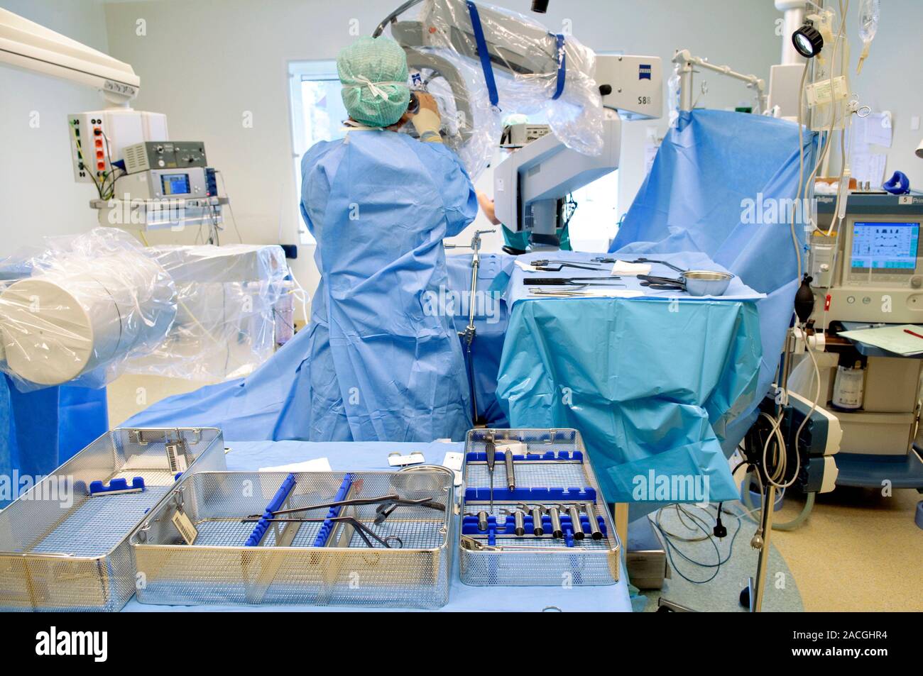 Slipped disc microendoscopy surgery. Surgeon performing an operation on ...