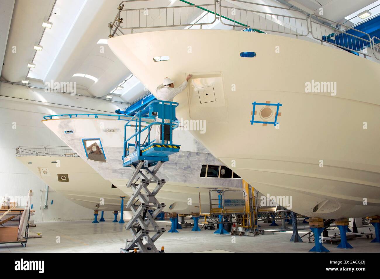 Luxury boat building. Luxury motoryachts being built at the Riva boat ...