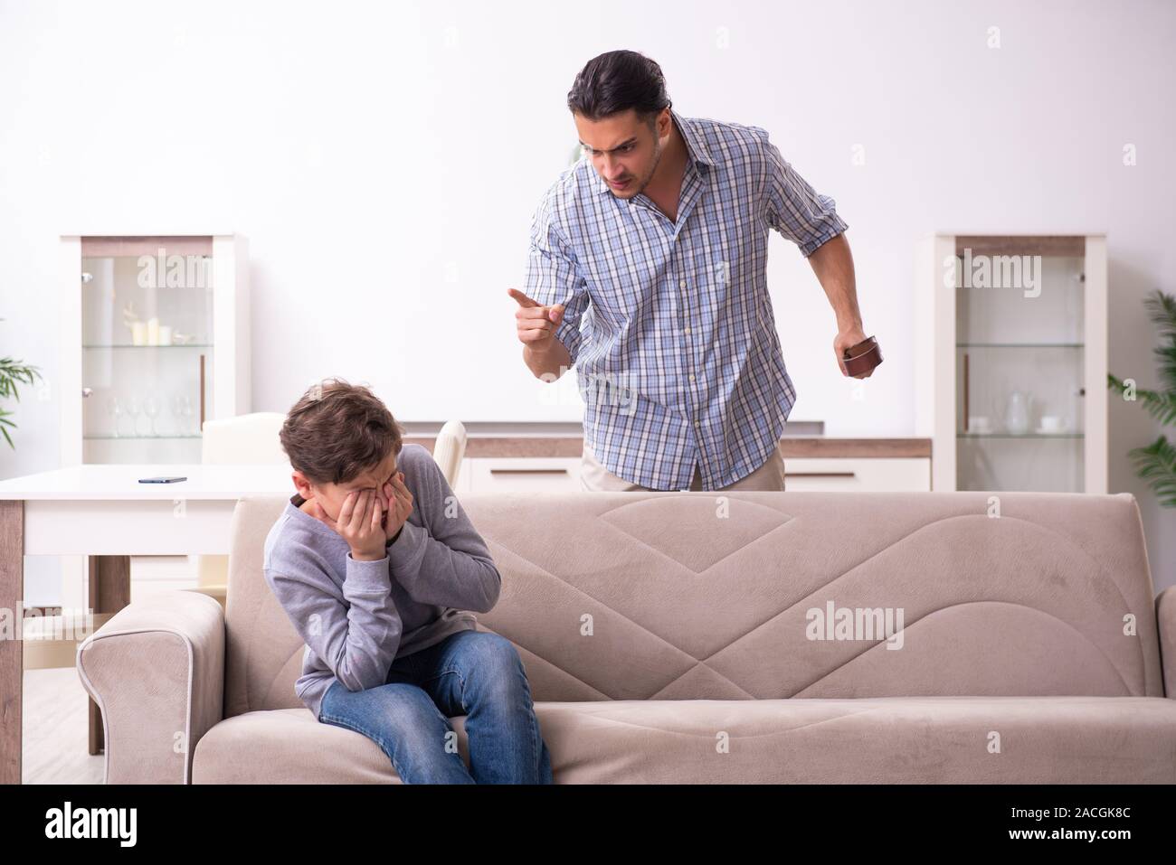 Father punish son hi-res stock photography and images - Alamy