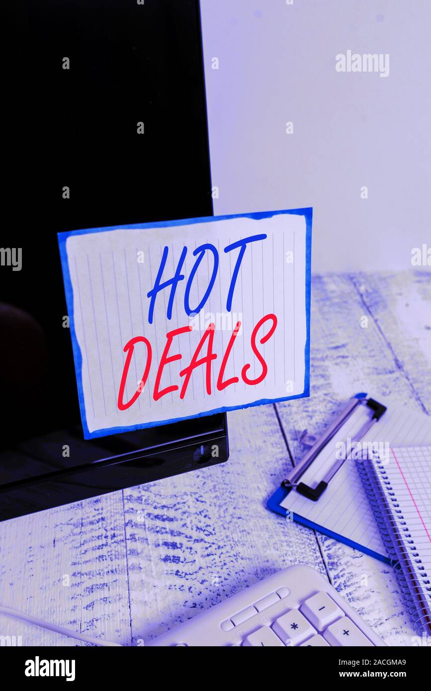 Writing note showing Hot Deals. Business concept for An agreement ...