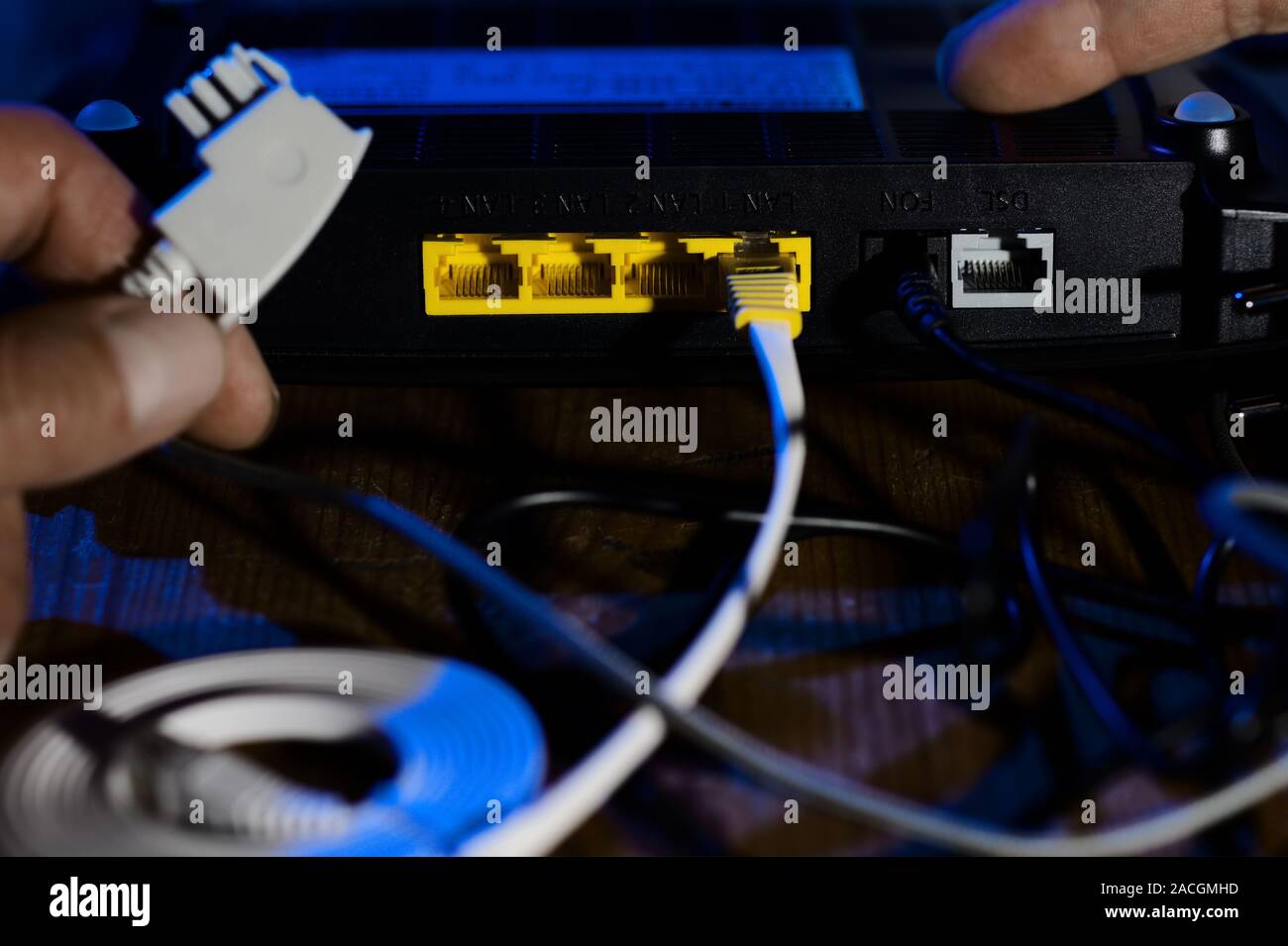Setting up wiring cables network internet router Stock Photo - Alamy