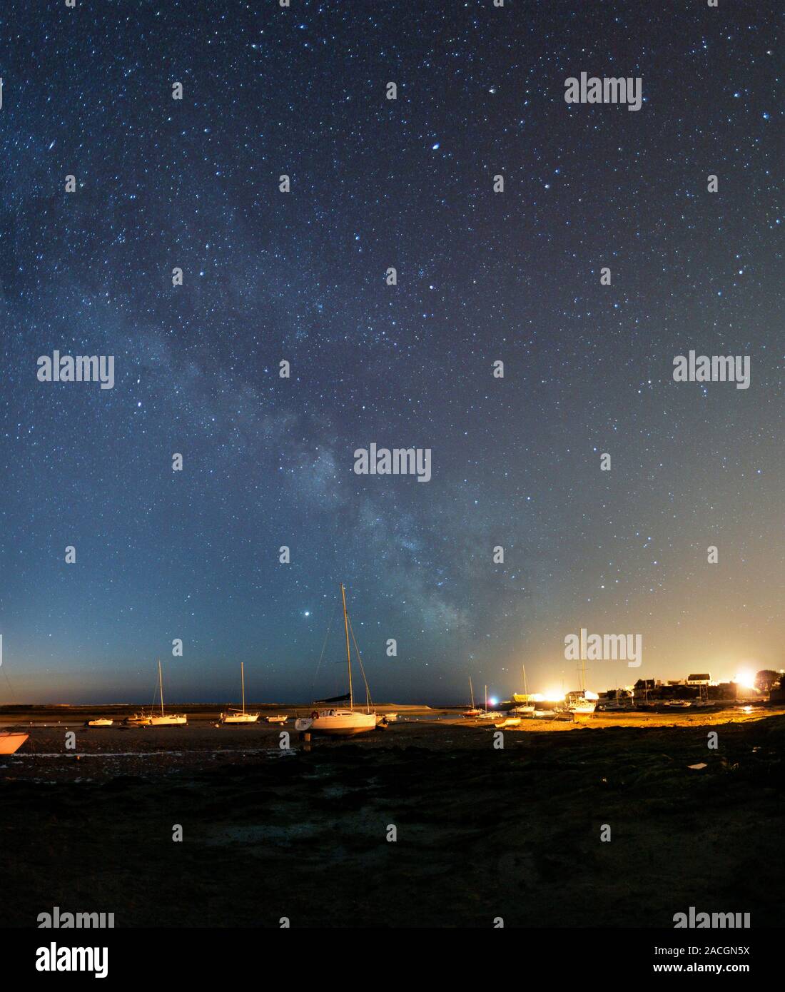 Stars in a night sky. Stars of the Milky Way over boats at low tide ...