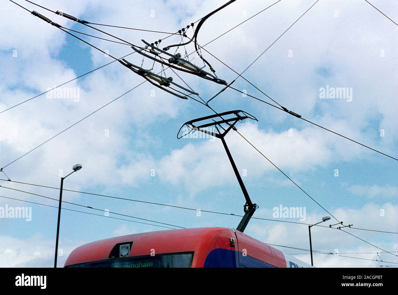 Tram power lines. Pantograph on top of a tram. This device connects the ...