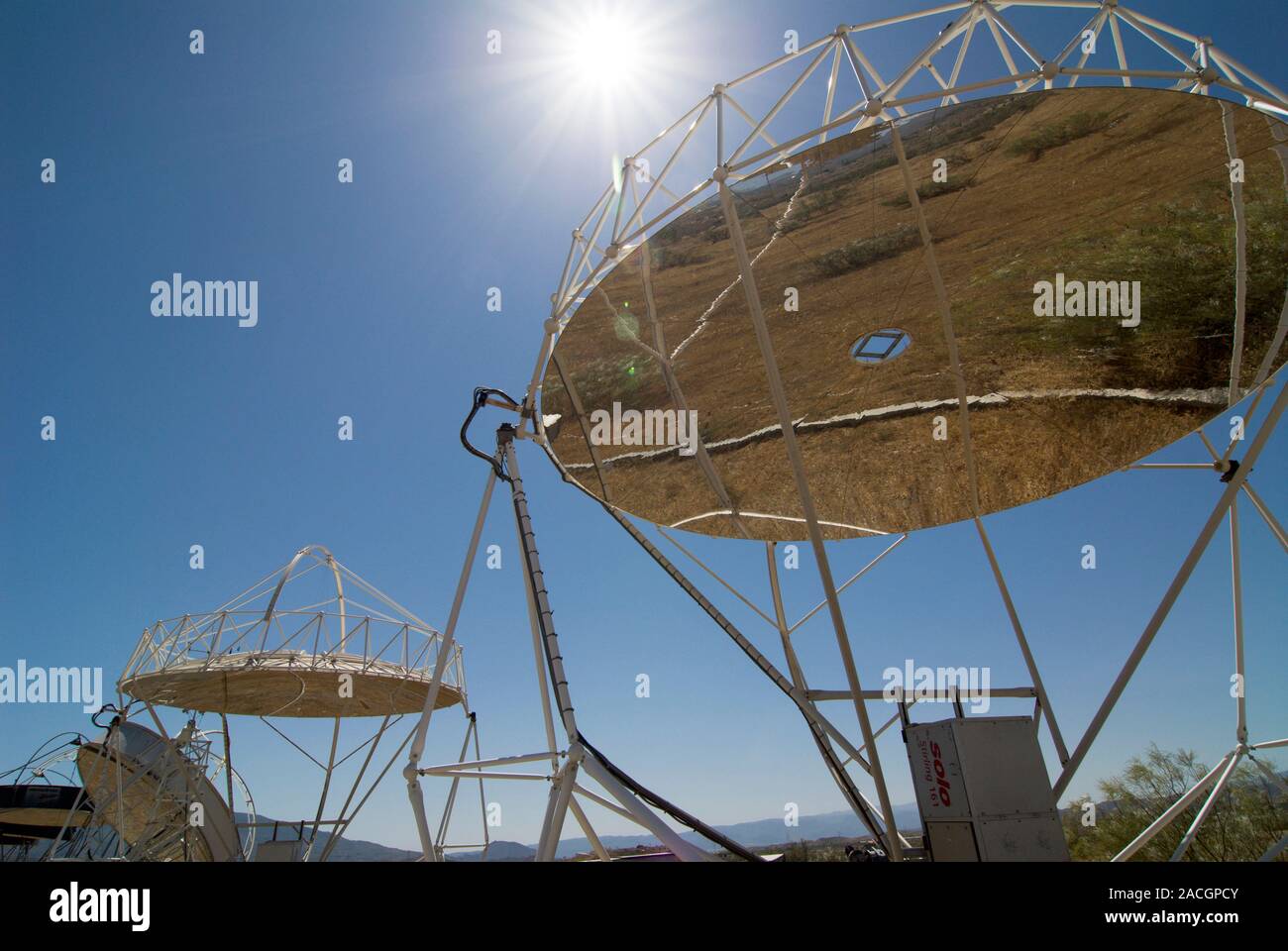 Solar furnace. Mirrors at a solar power station being built in the ...