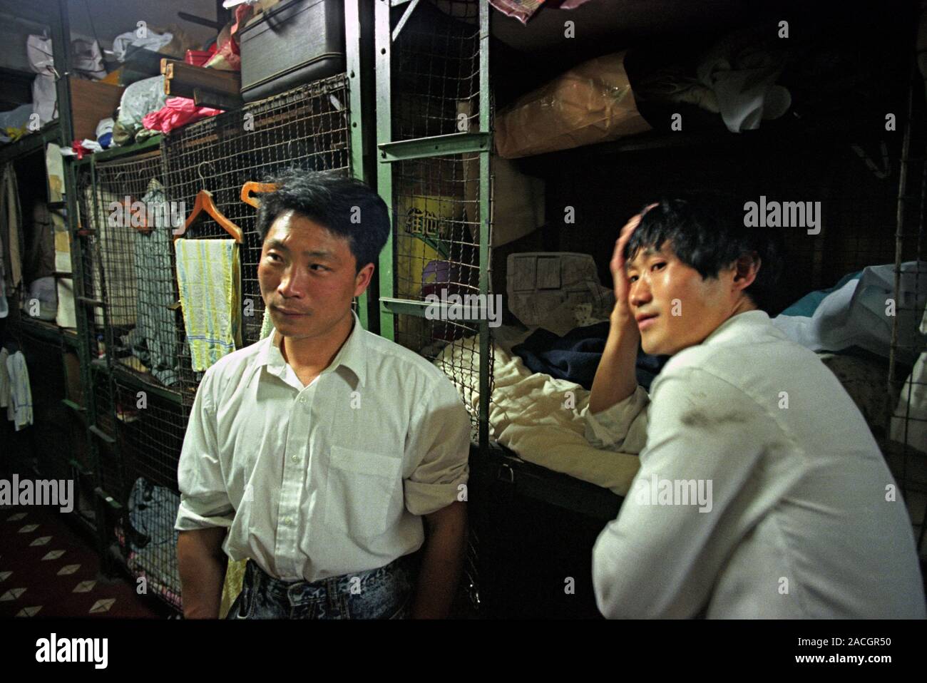 Cage housing, Hong Kong. Cage houses are a type of stacked temporary ...