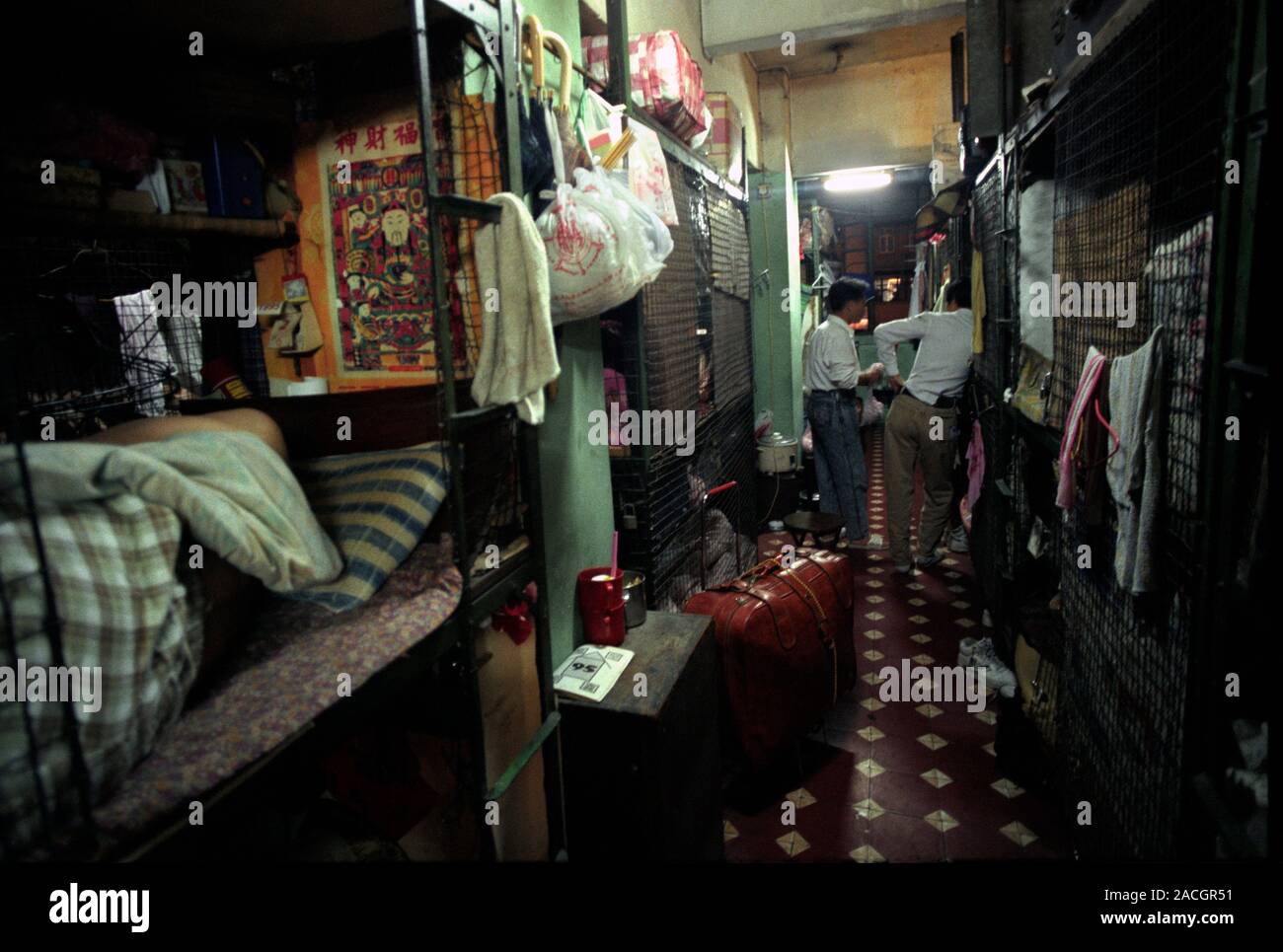 Cage housing, Hong Kong. Cage houses are a type of stacked temporary ...