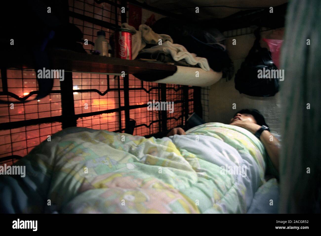 Cage housing, Hong Kong. Cage houses are a type of stacked temporary ...