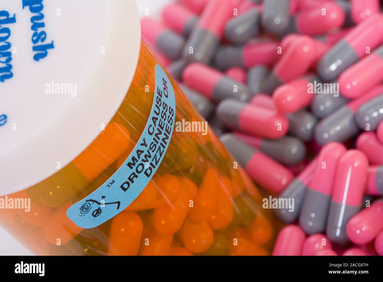 Prescription container with a warning label, with capsules Stock Photo ...
