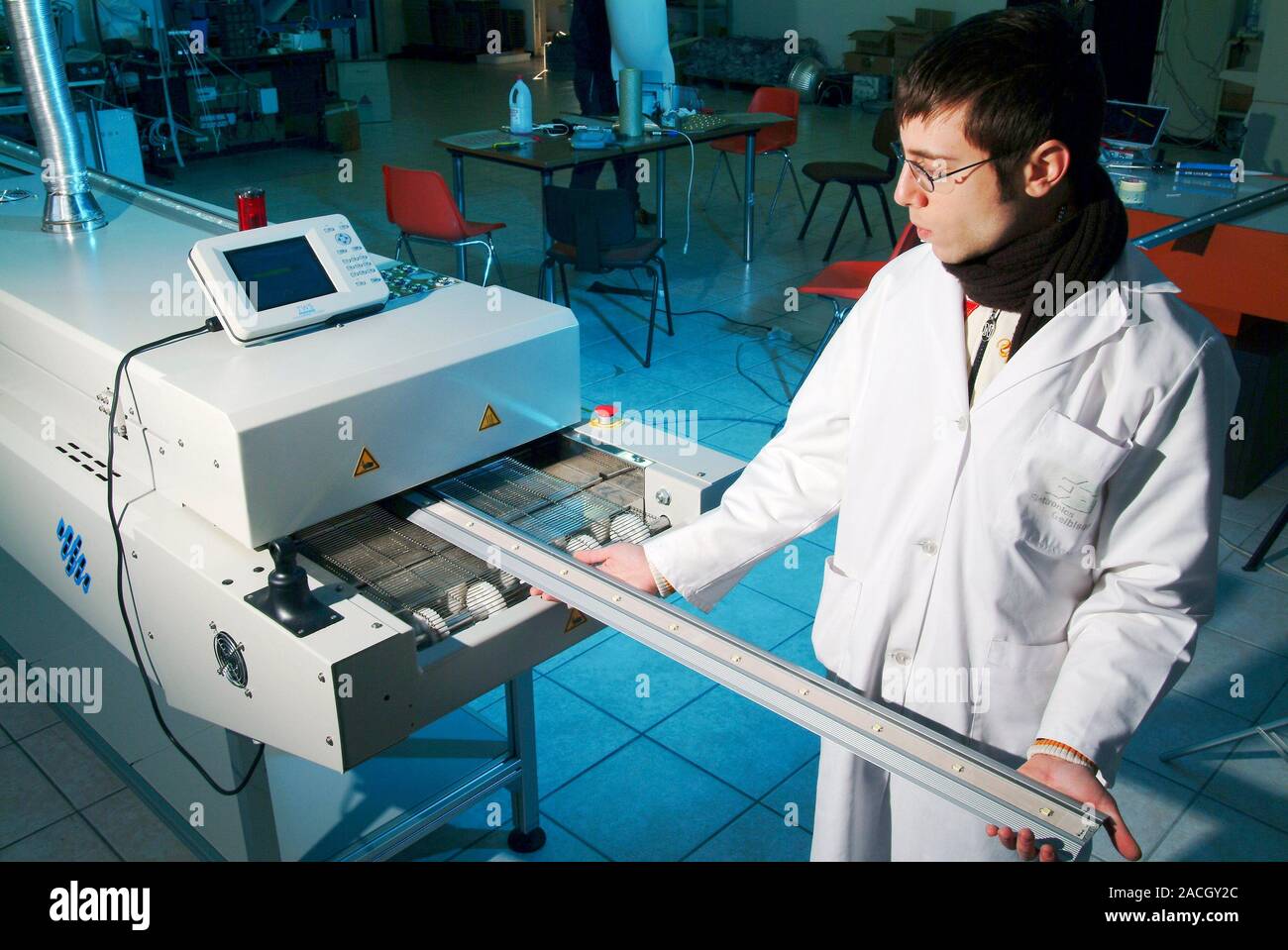 LED street lighting. Technician making an LED street lighting system to ...