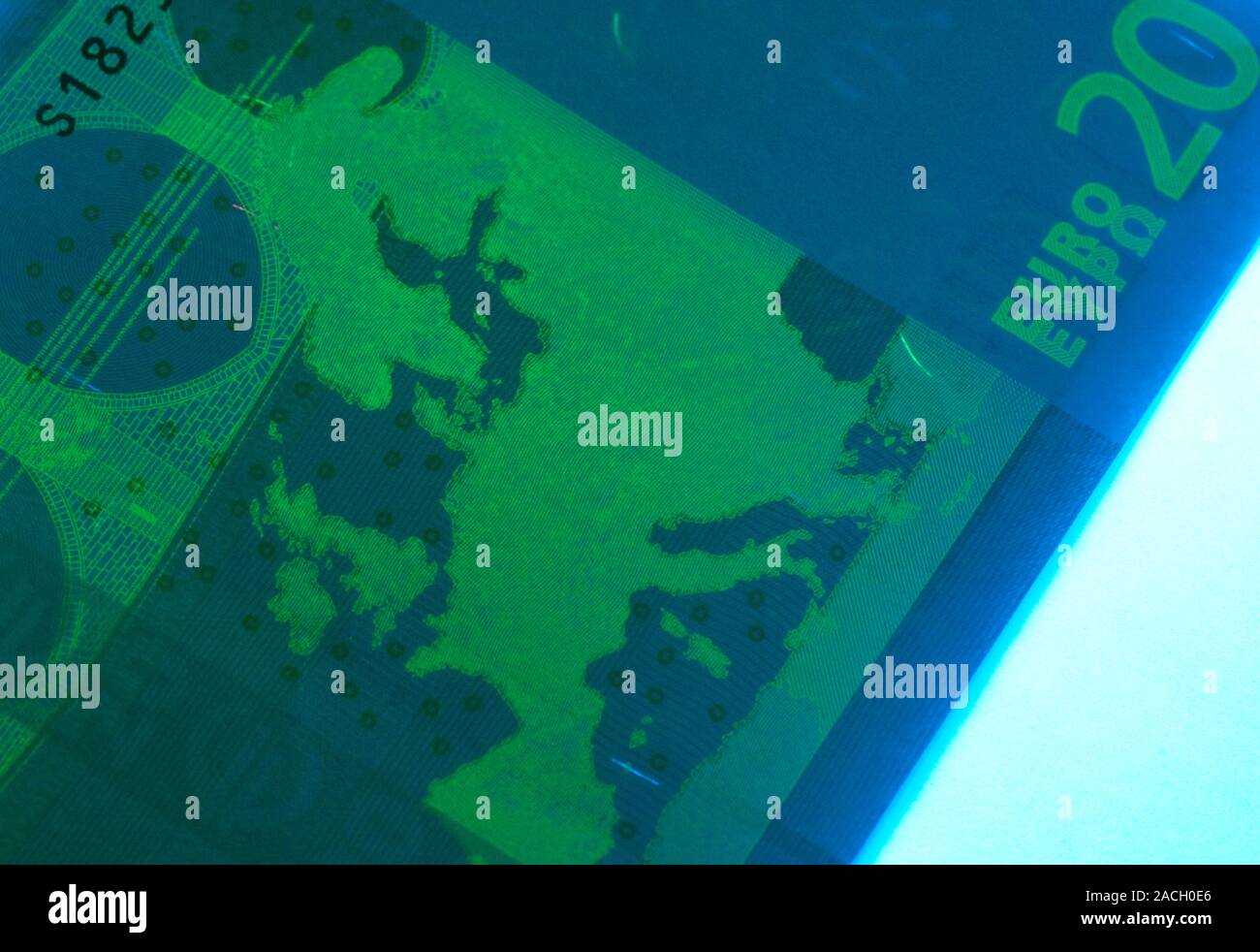 Euro banknote in UV light, close up. The design on this 20 Euro ...