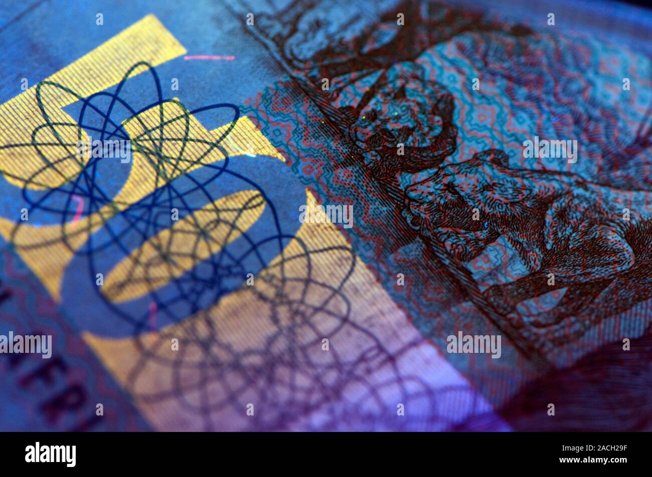 South African banknote in UV light. Close up of a 50 Rand banknote ...