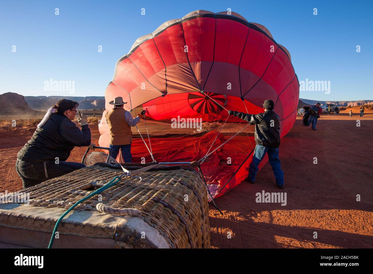 A team inflates a hot balloon in preparation for launch in the Monument ...