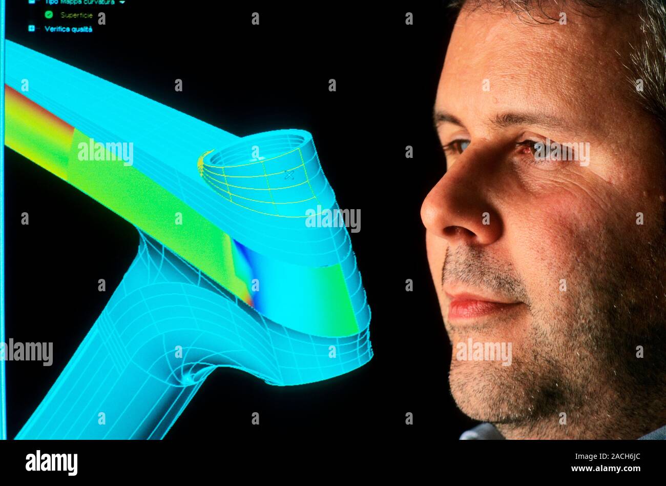 Racing bicycle development. Designer in front of a computer graphic of ...
