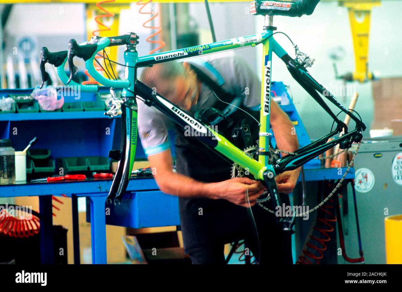 Racing bicycle development. Worker assembling a new model of racing ...