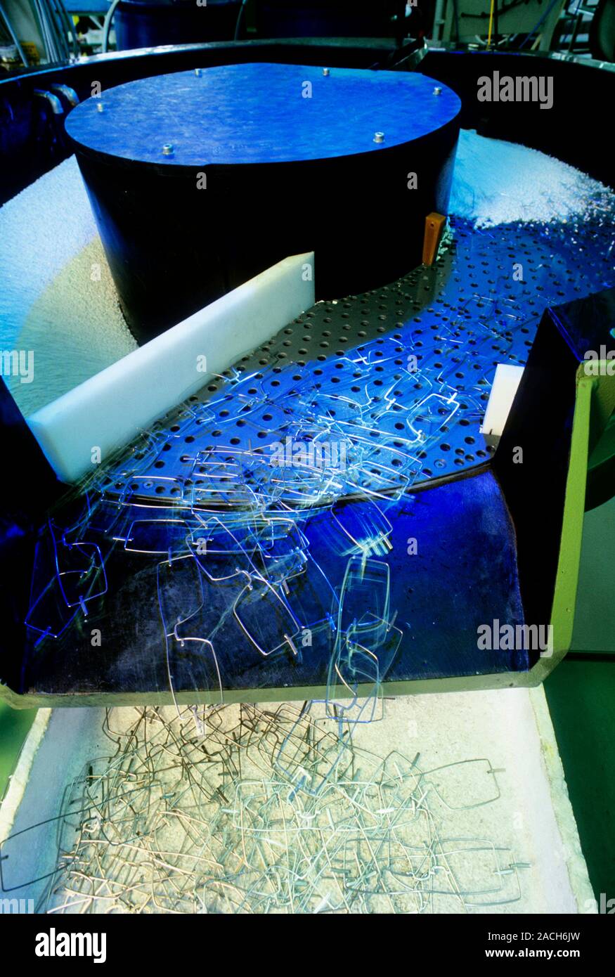 Eyeglasses manufacturing. Titanium frames on a production line in an ...