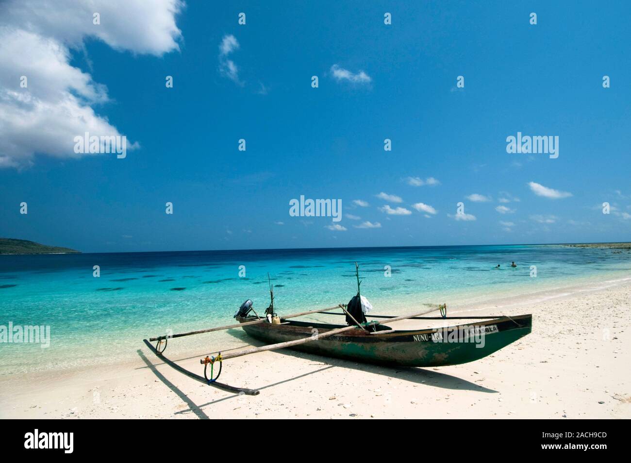 Traditional fishing boat, Timor-Leste. Traditional outrigger boat used ...
