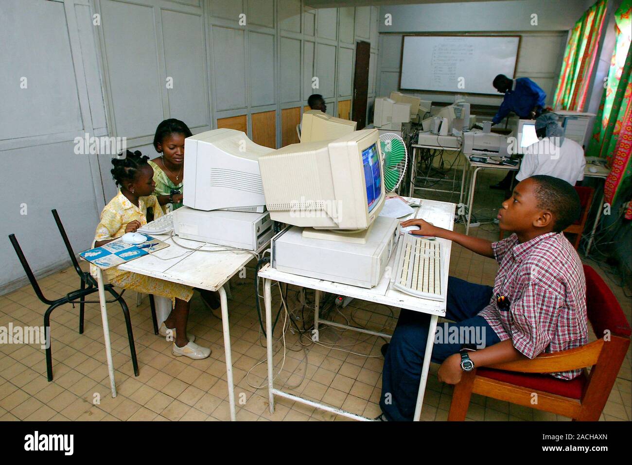 Computer use. Adults and children using computers at Lovanium ...