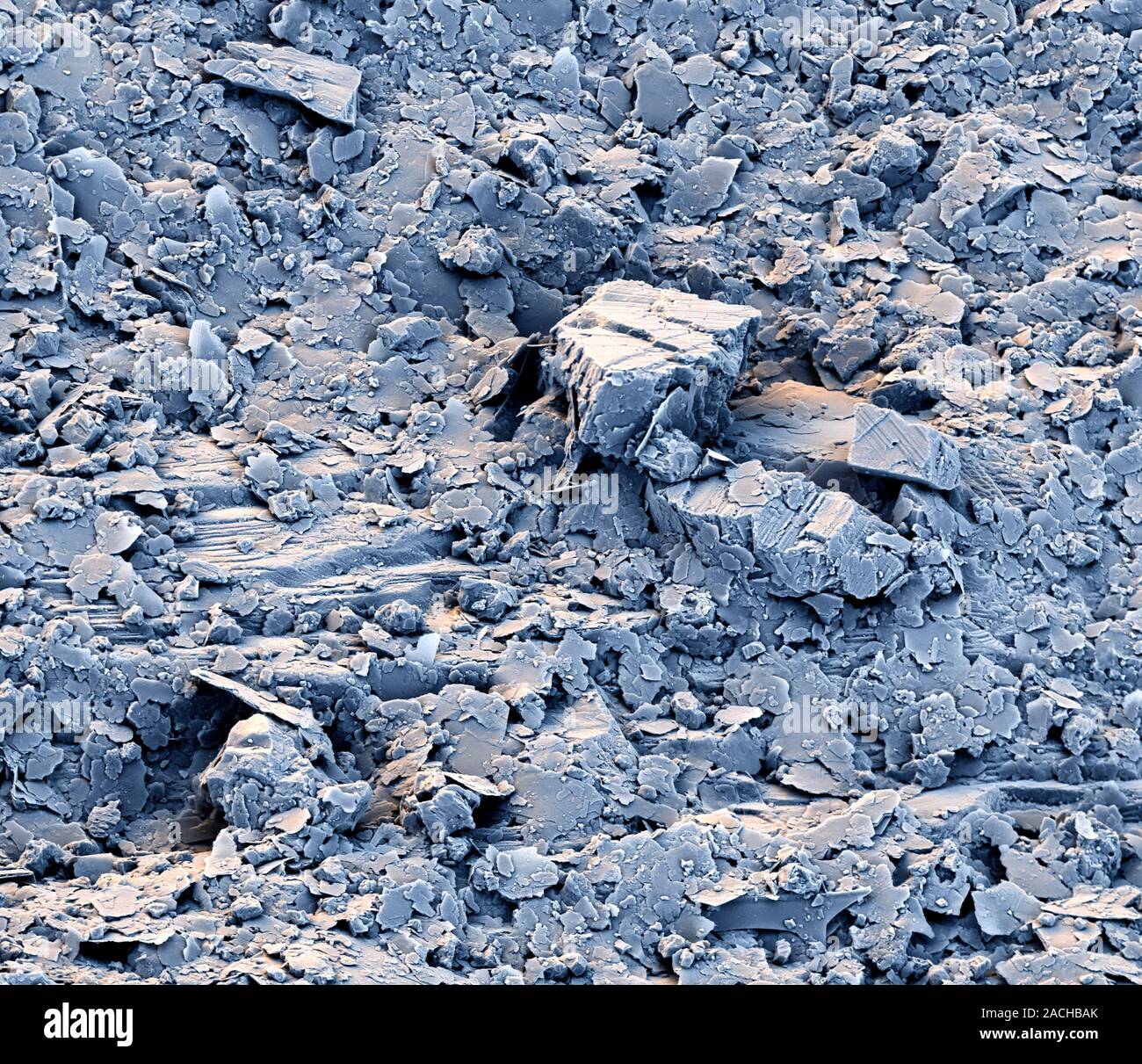 Clay-based plaster. Coloured scanning electron micrograph (SEM) showing ...