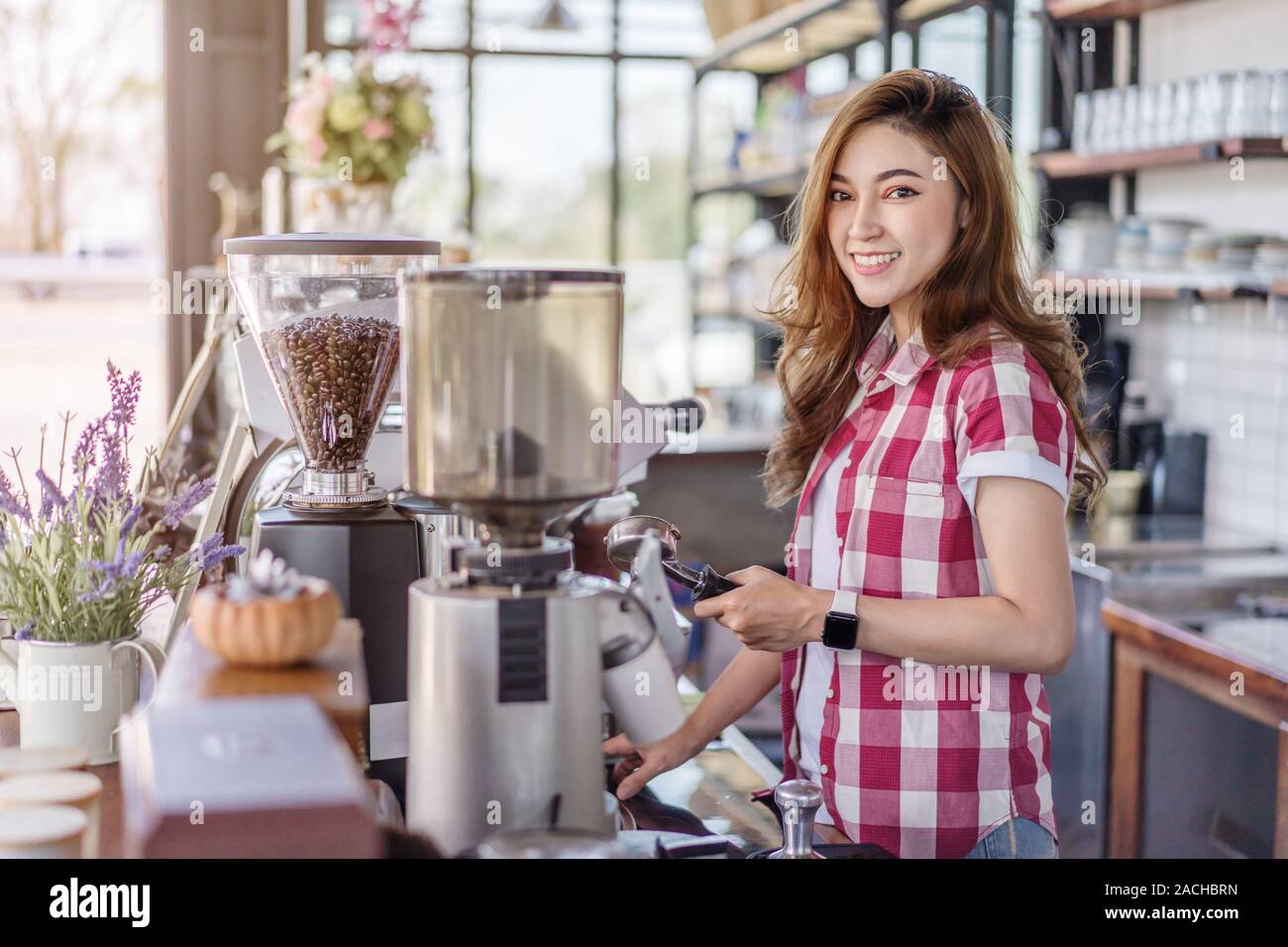Happy asian barista woman coffee hi-res stock photography and images - Alamy