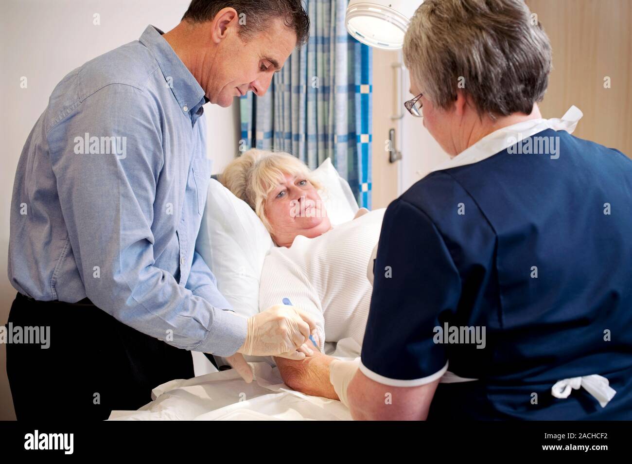 Diathermy. Doctor using diathermy on a patient in a hospital. Diathermy ...