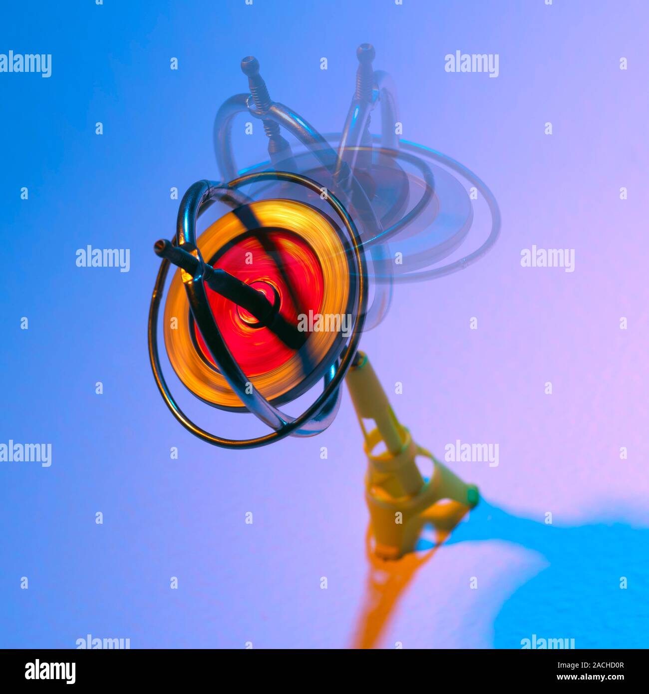 Toy gyroscope spinning. A gyroscope is a heavy spinning disc mounted so ...