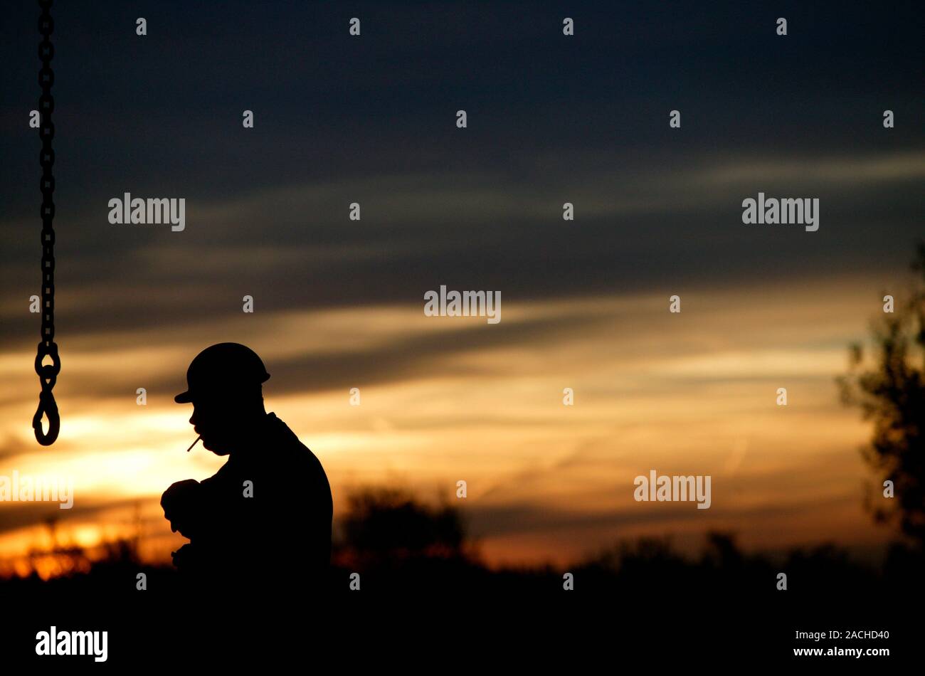 Construction worker smoking Stock Photo - Alamy