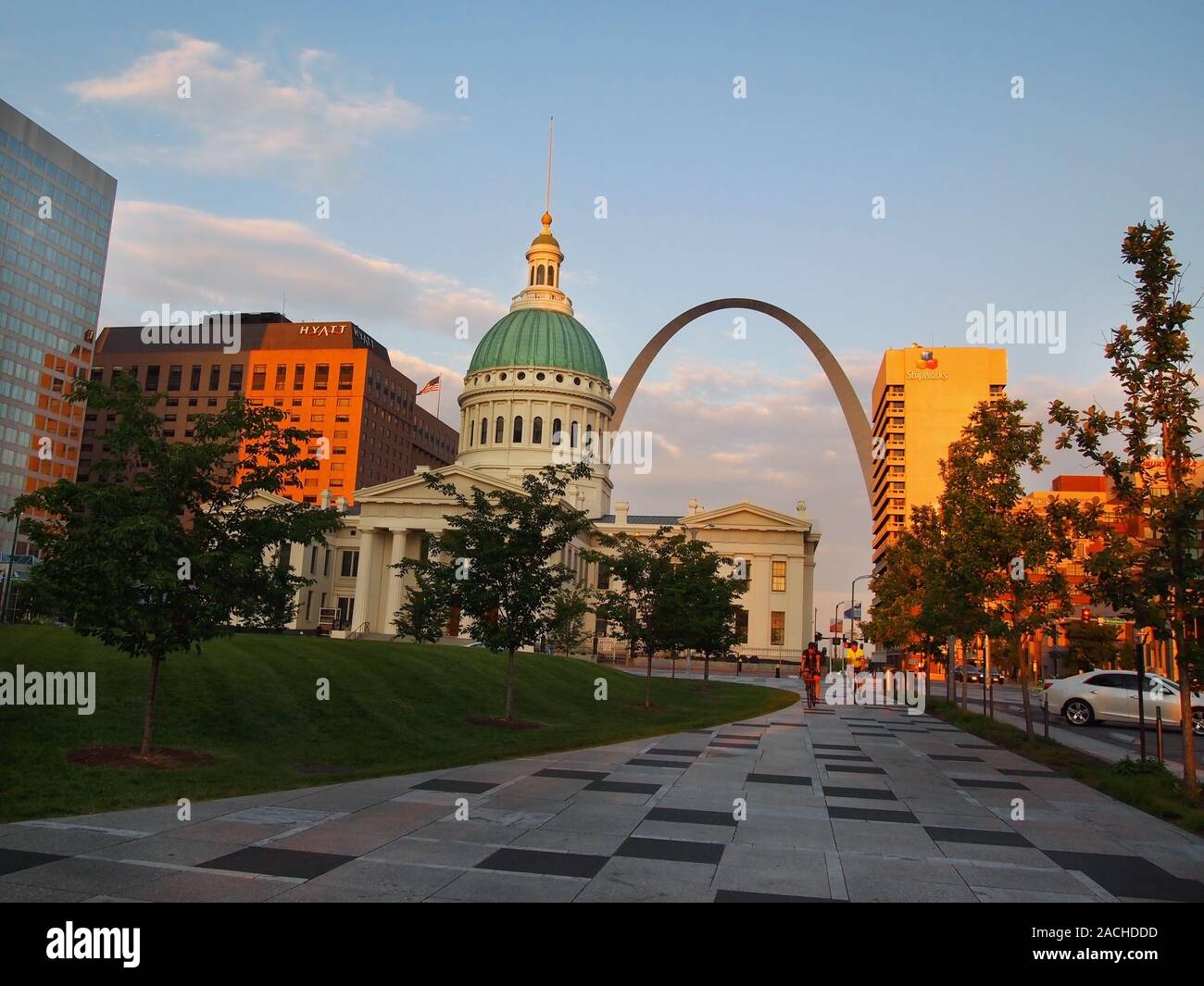 ST. LOUIS, MISSOURI - JULY 9, 2018: A pair of bicyclists ride side by ...