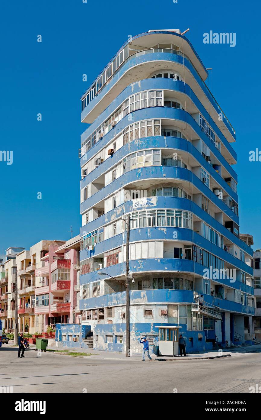 Blue apartment building needs repainting Stock Photo - Alamy