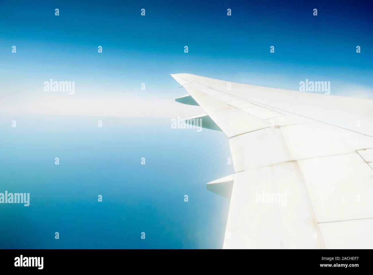 Aeroplane wing. View of the wing of a commercial jet aircraft in flight ...