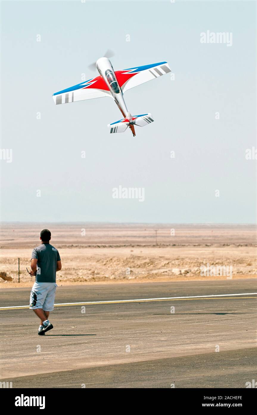 Model aircraft competition. Person flying a model aeroplane at the ...