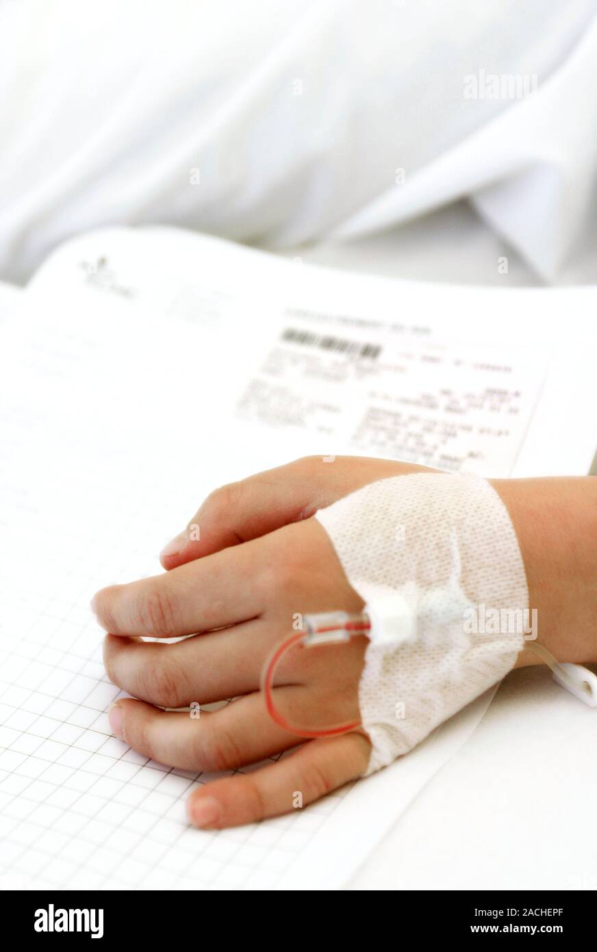 Hospital care. Close-up of a cannula in the hand of a paediatric ...
