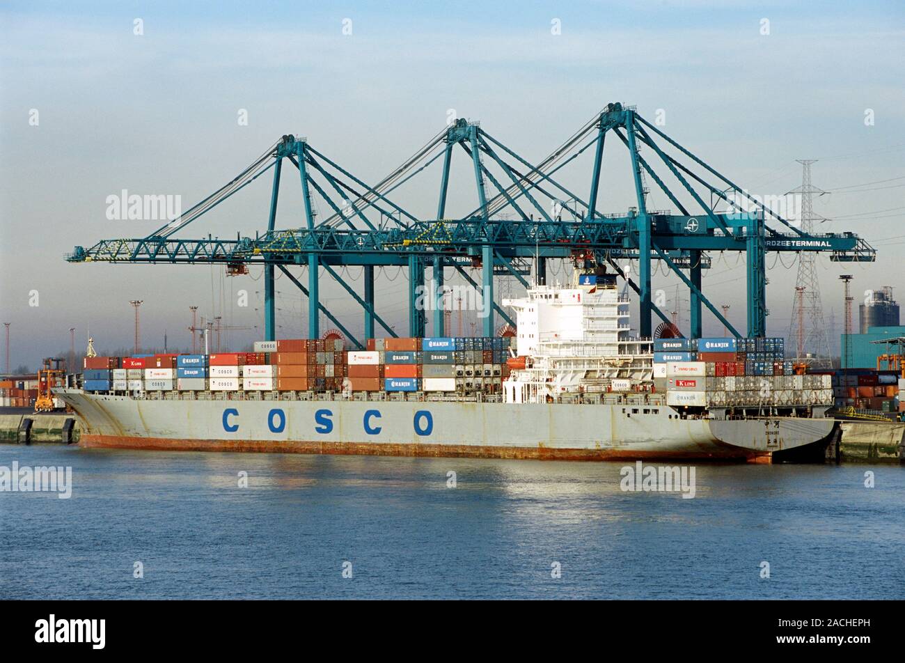 Container docks. Cargo ship moored at a dock. Photographed in Antwerp ...