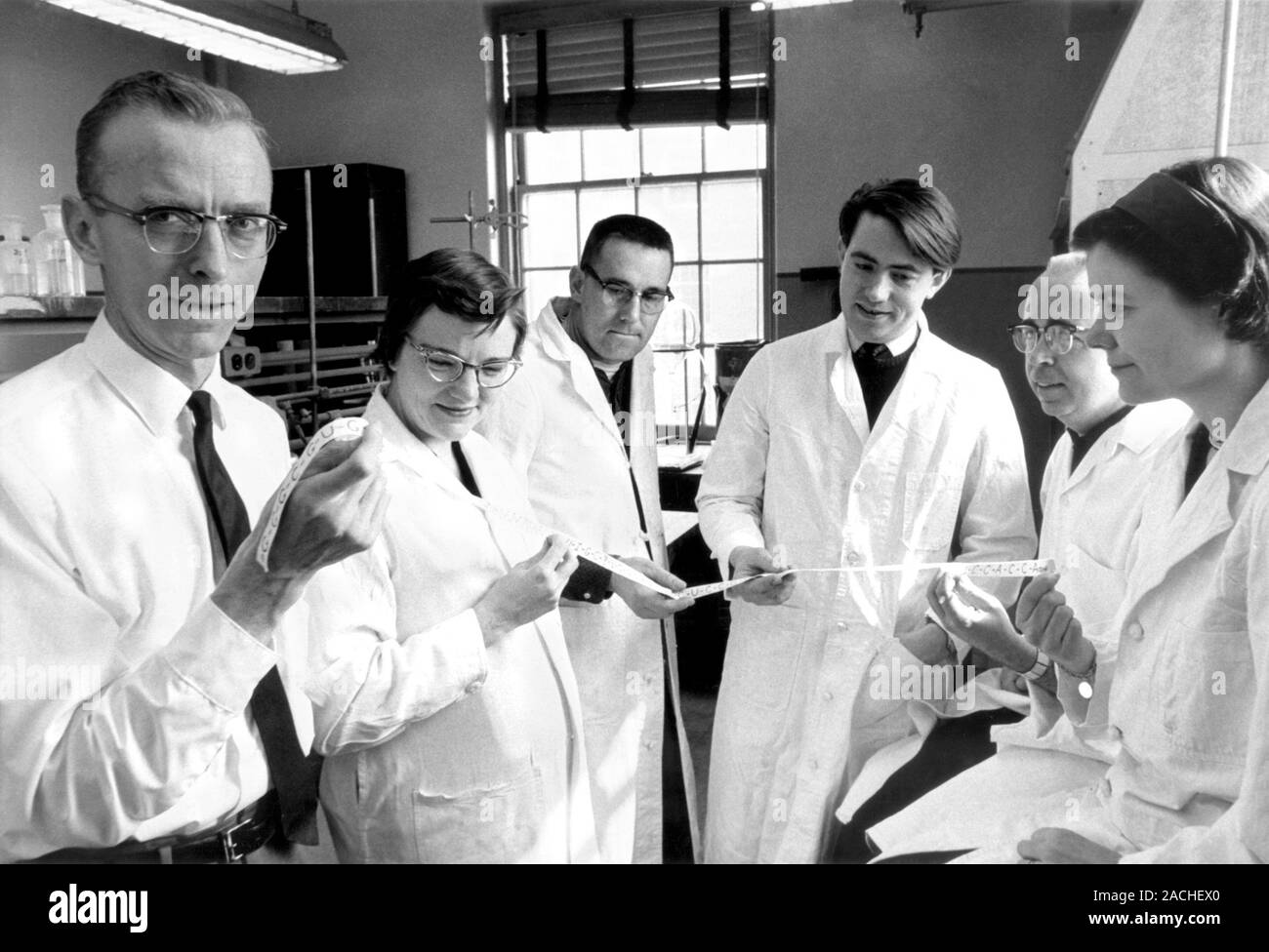 Robert William Holley (1922-1993, far left), US biochemist, with a ...