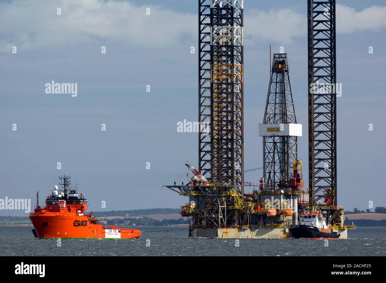 Jackup oil drilling rig. Ensco 80 oil rig being towed up the Cromarty ...