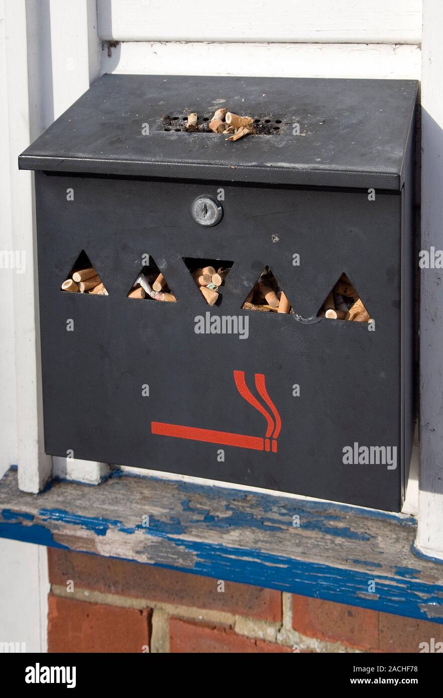Full cigarette bin. These bins are provided in outdoor areas for ...