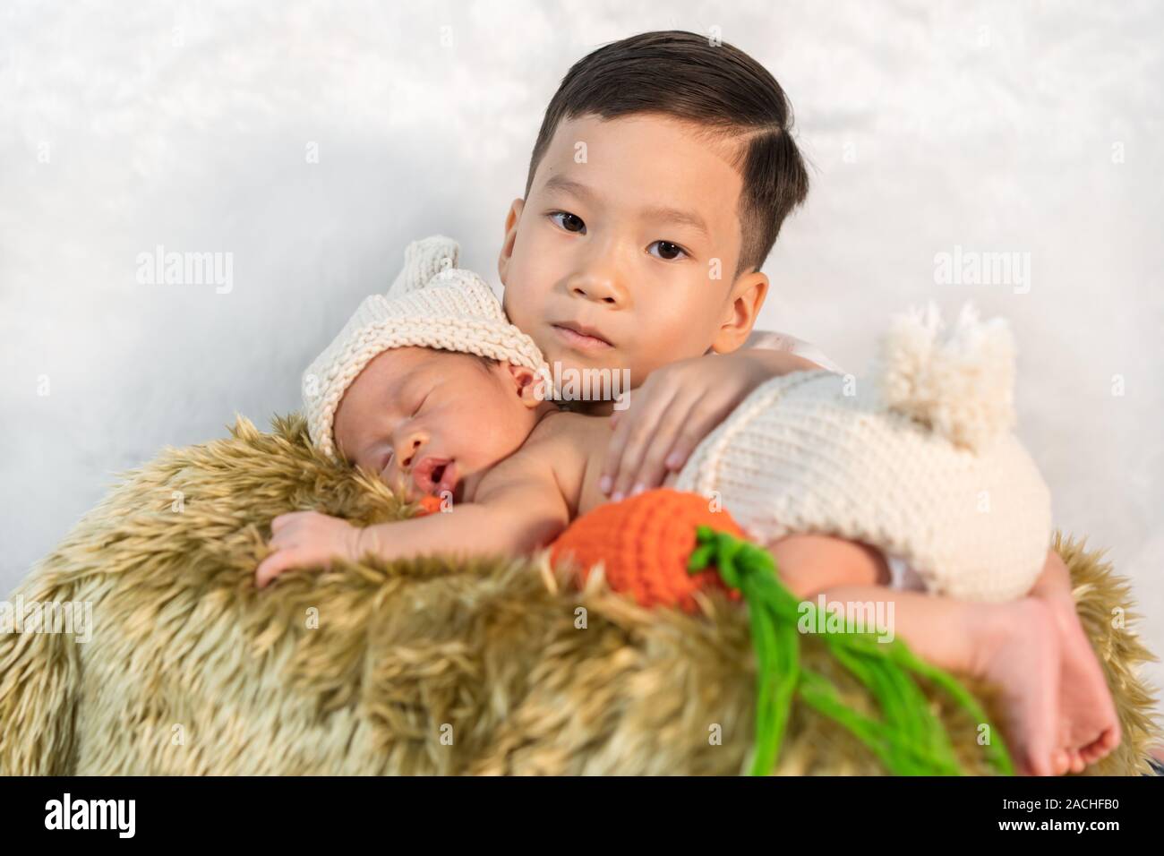 Baby hugging bunny hi-res stock photography and images - Alamy