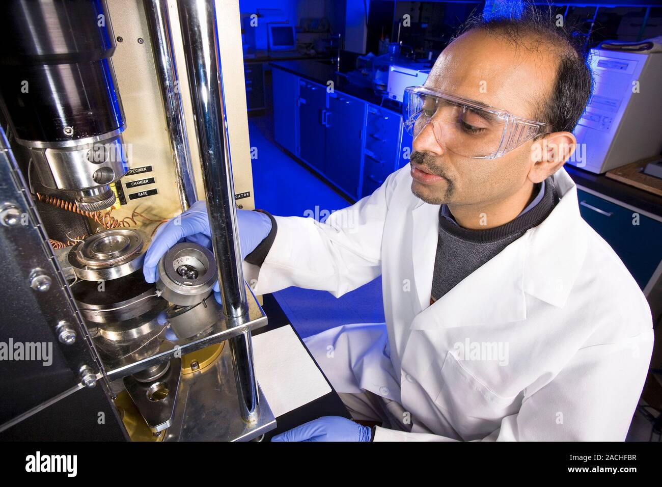 Lubricant additives testing. Chemist using a standard four-ball test ...