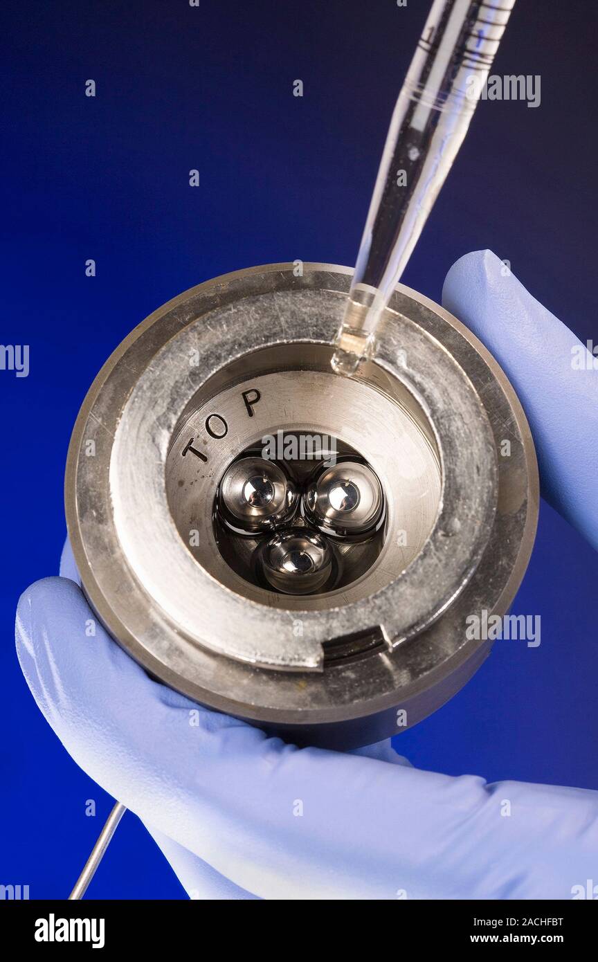 Lubricant additives testing. Chemist using a standard four-ball test ...